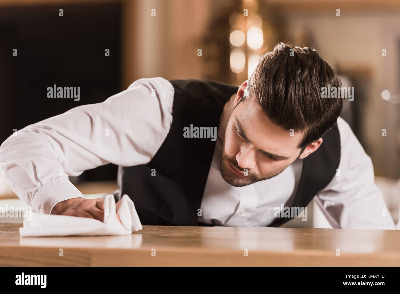 bartender cleaning bar counter Stock Photo - Alamy