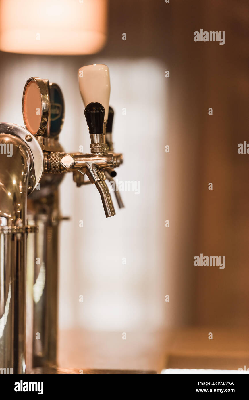 Beer taps at bar counter Stock Photo - Alamy