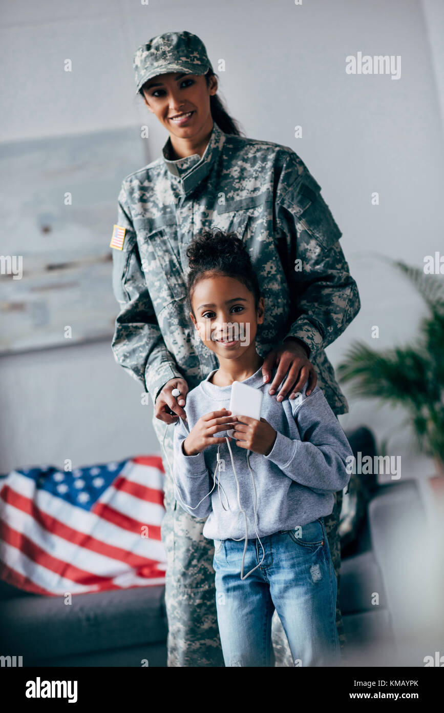 daughter and mother in military uniform Stock Photo - Alamy