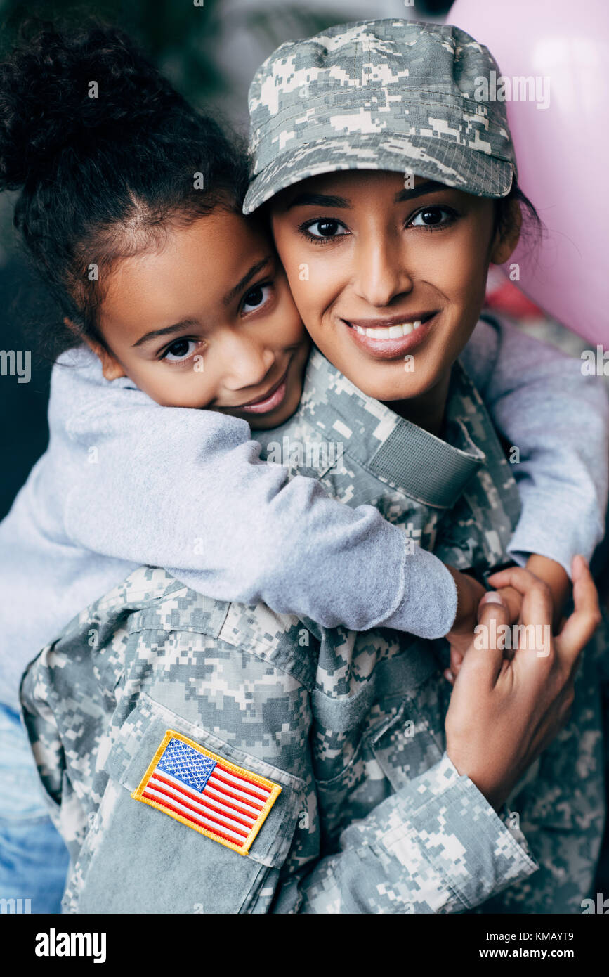 African Military Soldier Hugging Daughter High Resolution Stock ...
