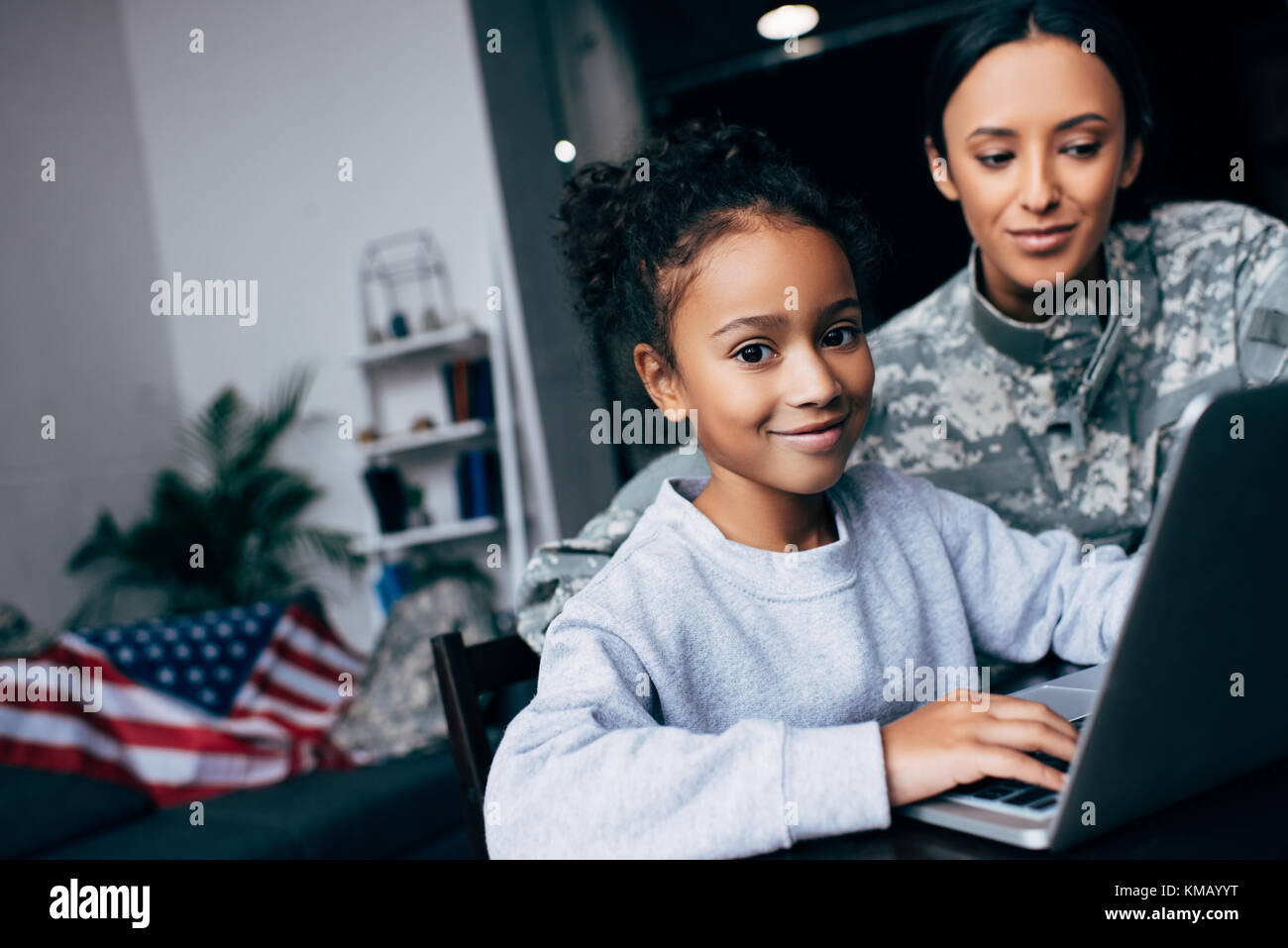 mother and daughter using laptop Stock Photo - Alamy