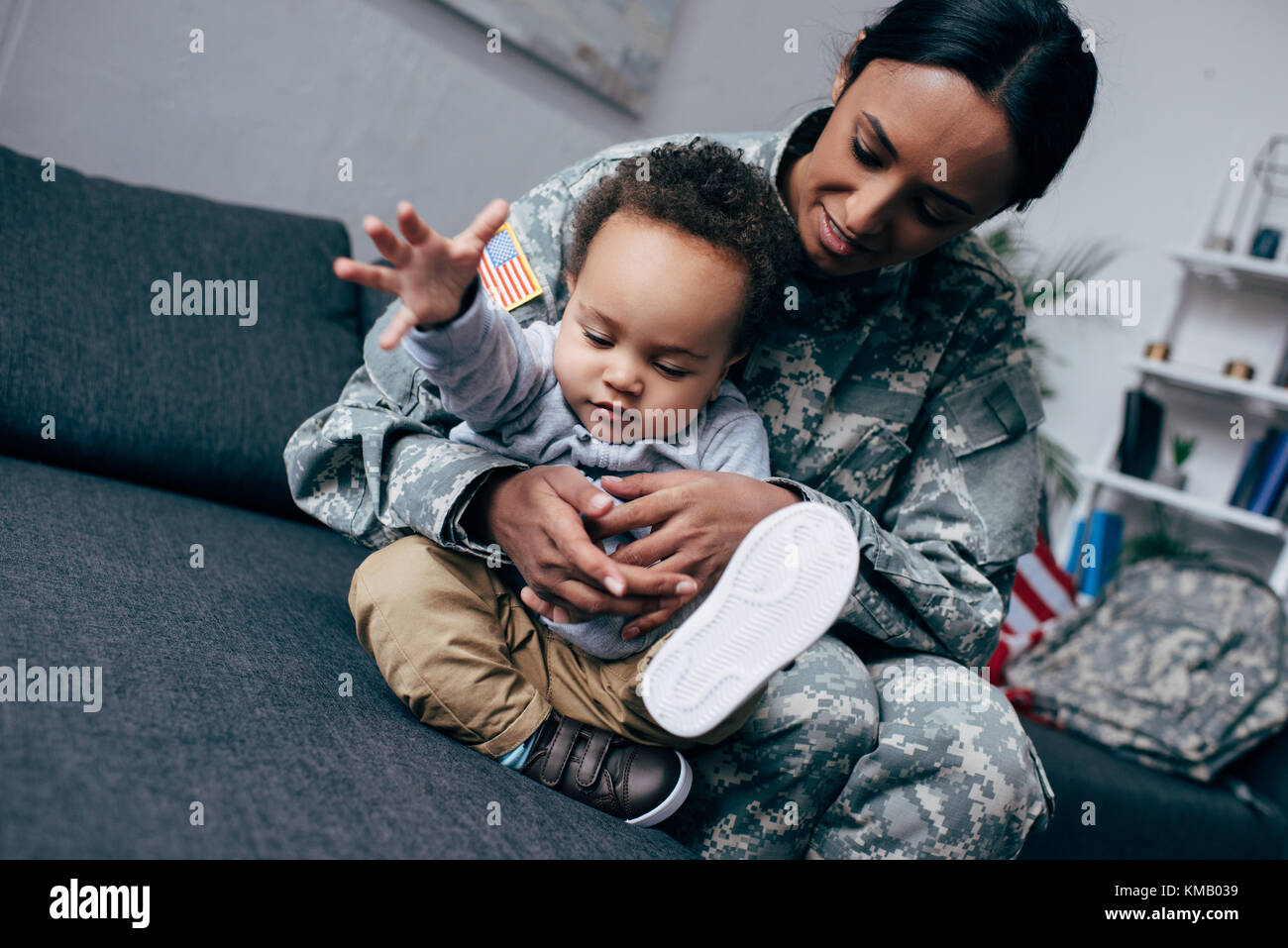 mother in military uniform with little son Stock Photo - Alamy