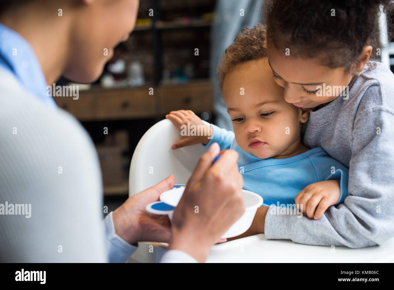 family feeding baby Stock Photo - Alamy