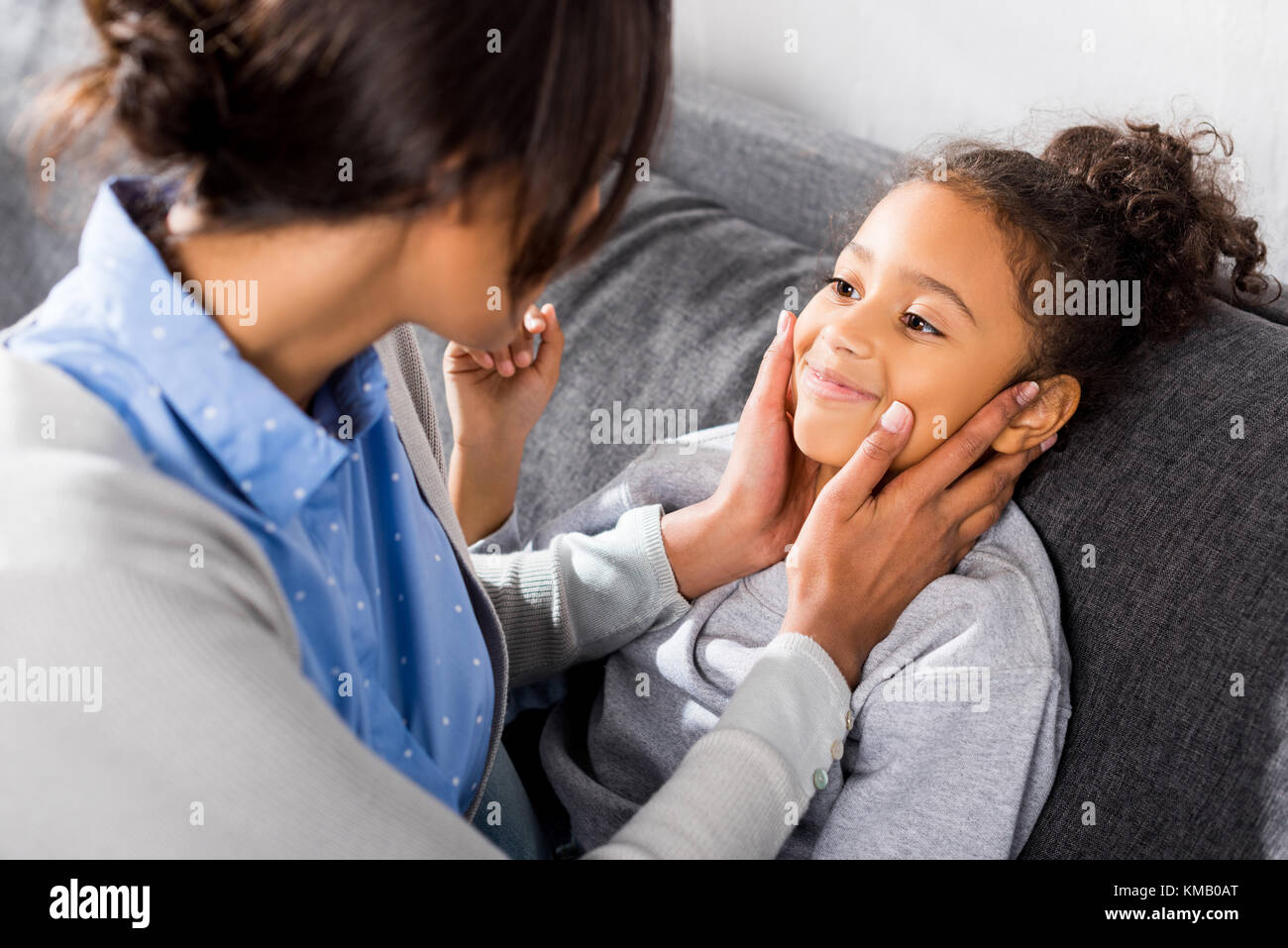 hugging african american mother and daughter Stock Photo - Alamy