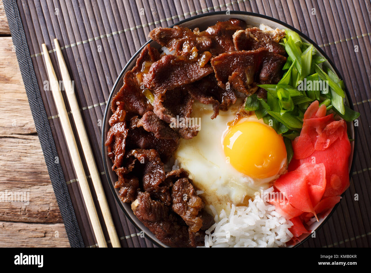 Japanese Beef Rice Bowl, Gyudon close-up in a bowl on the table ...
