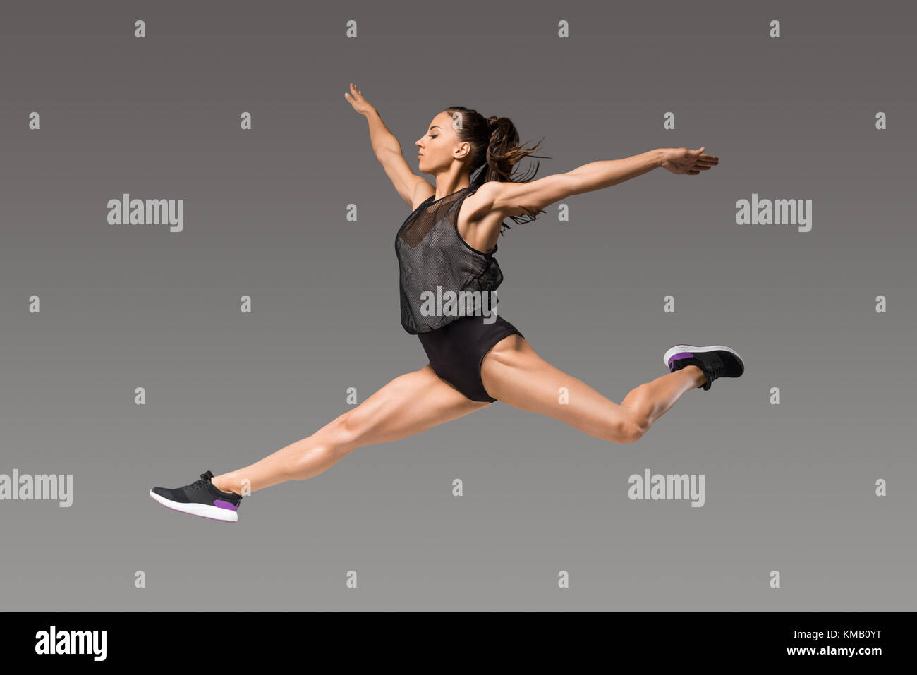 athletic girl jumping Stock Photo - Alamy