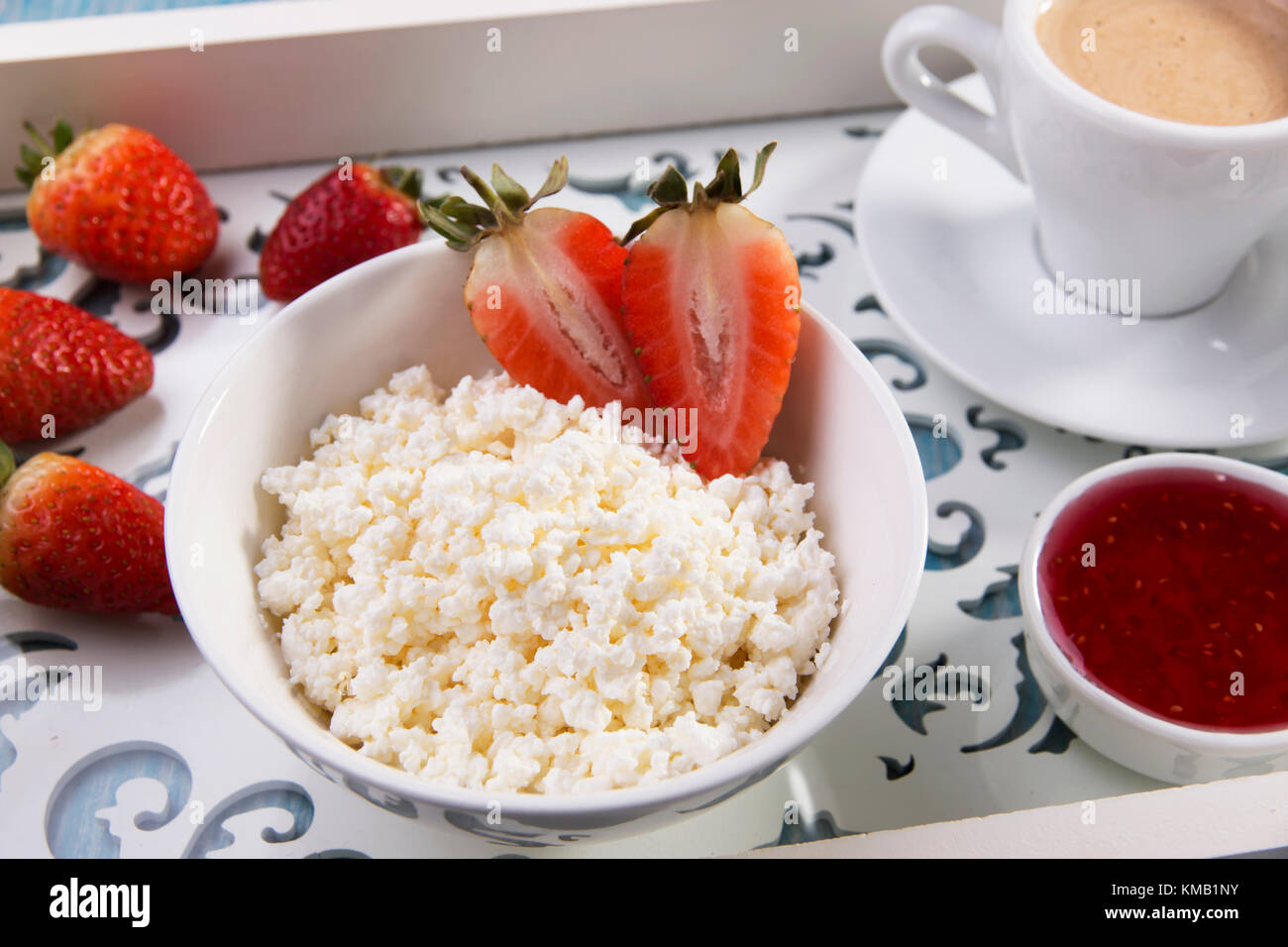 cottage cheese grainy crumbly with pieces of strawberries jam Stock ...