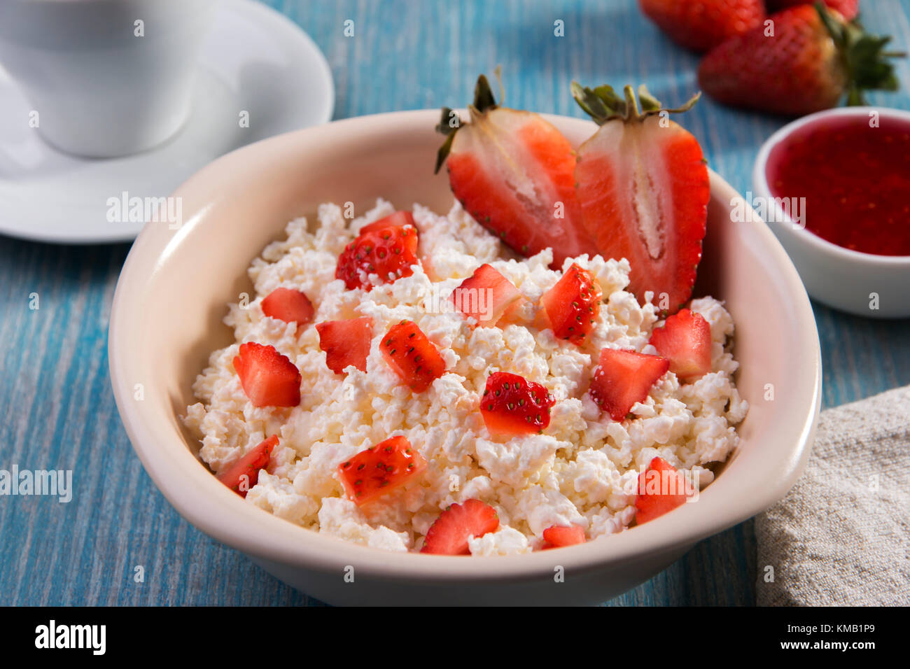 cottage cheese grainy crumbly with pieces of strawberries jam Stock ...