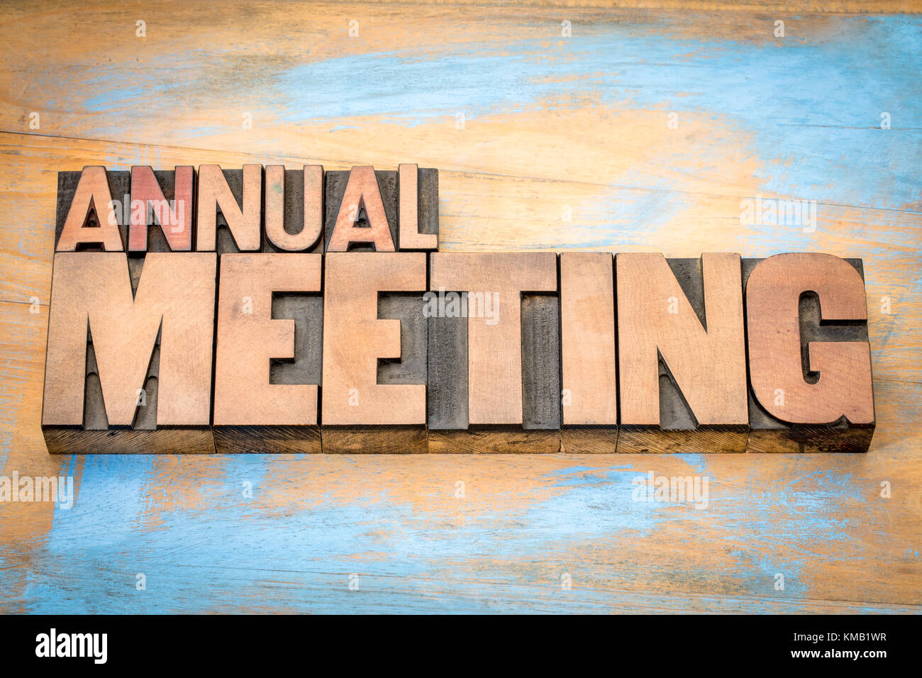 annual meeting word abstract in letterpress wood type against grunge ...