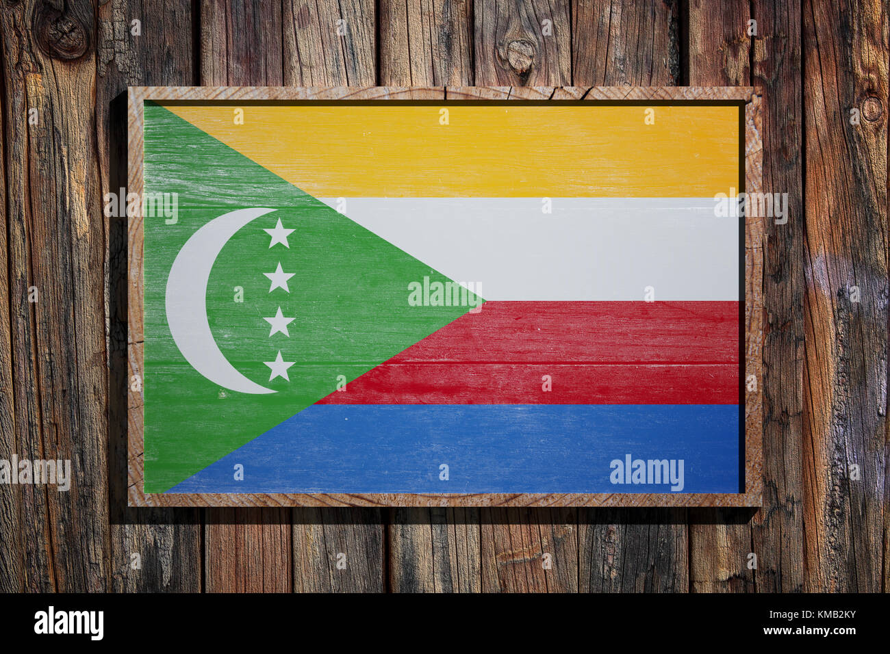 3d rendering of Union of the Comoros flag on a wooden frame over a ...