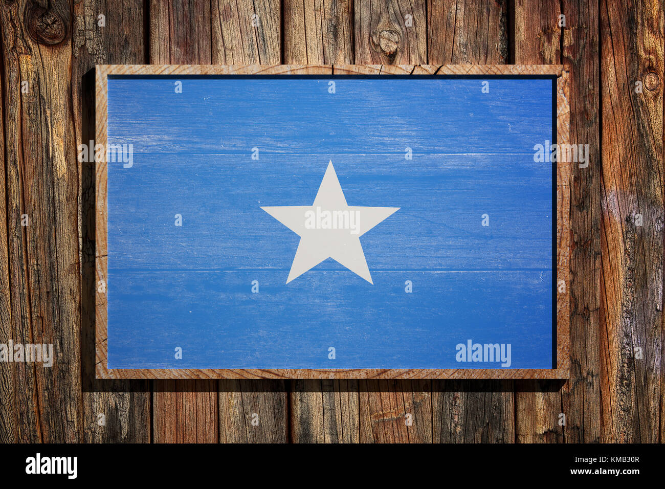 3d rendering of Somalia flag on a wooden frame over a planks wall Stock ...