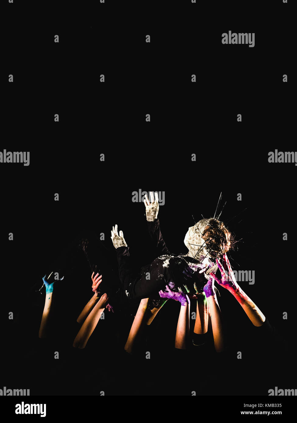 banner social concept. hands in paint raised up on a black background ...