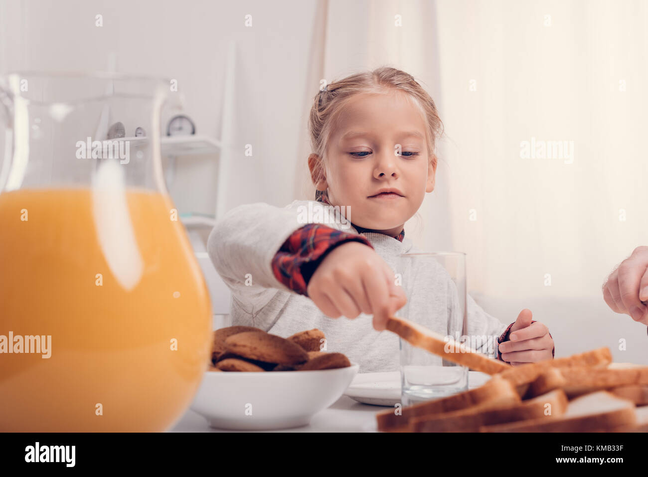 kid eating toasts Stock Photo - Alamy