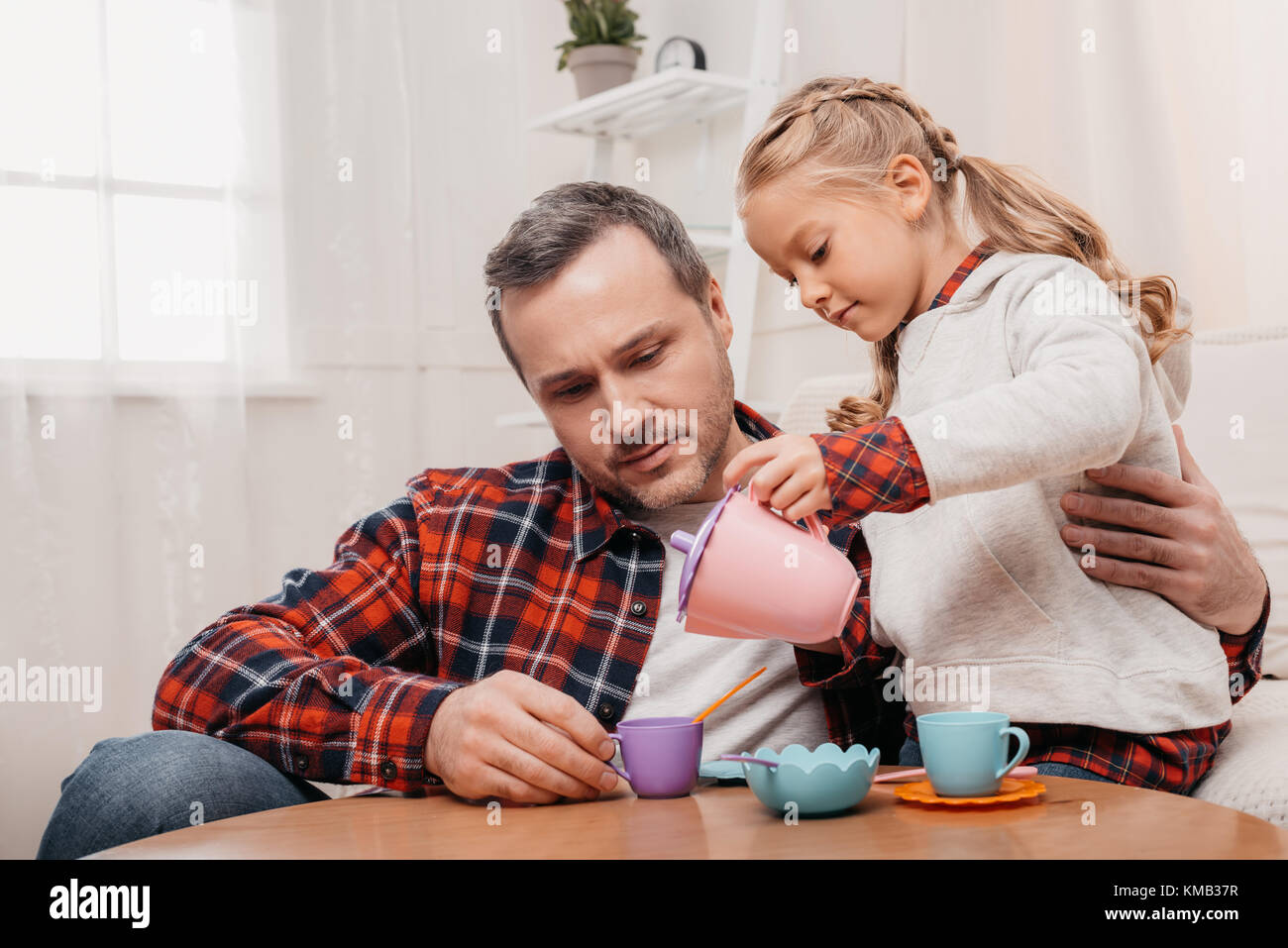 child having tea party with father Stock Photo - Alamy