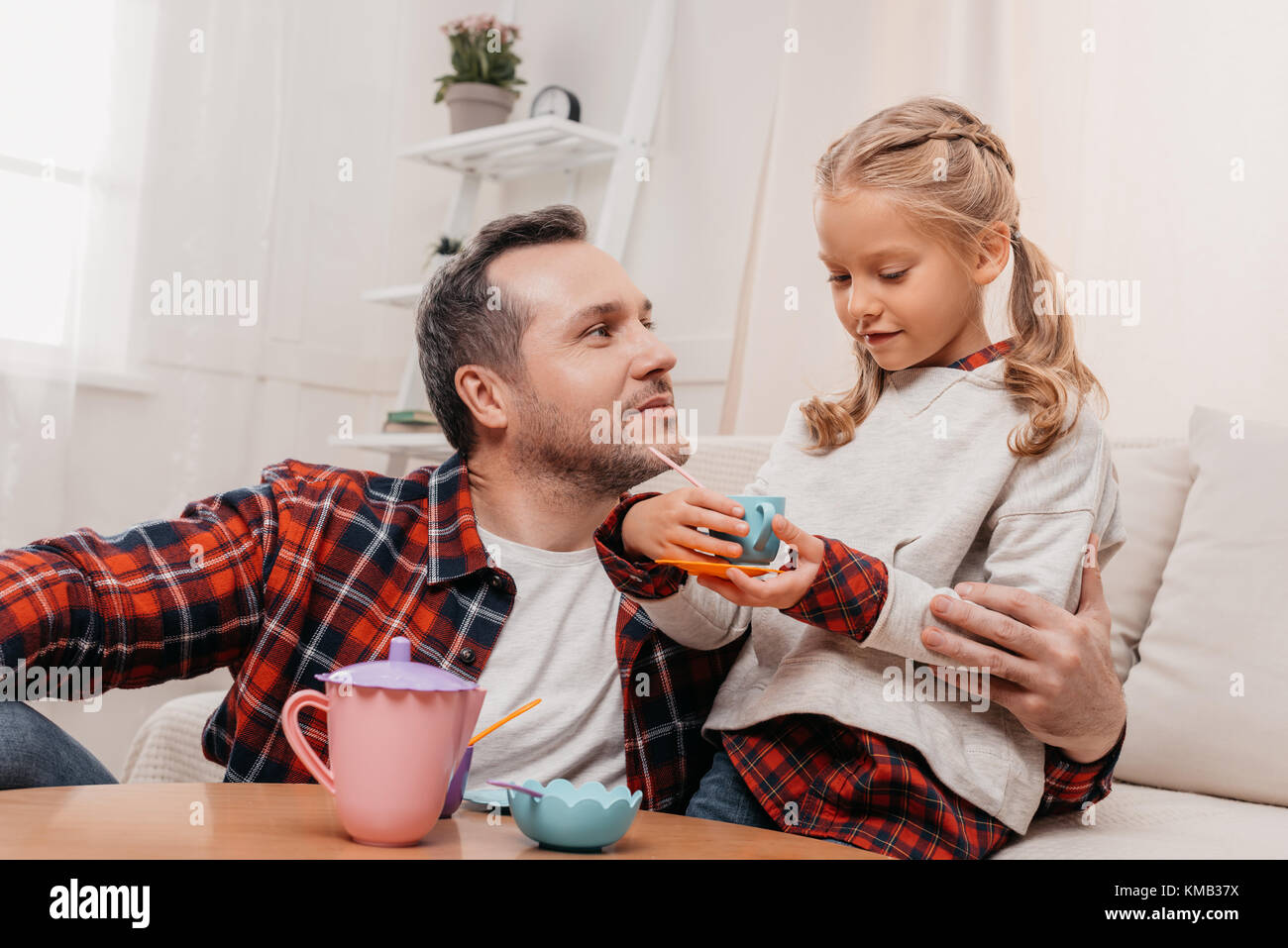 child having tea party with father Stock Photo - Alamy