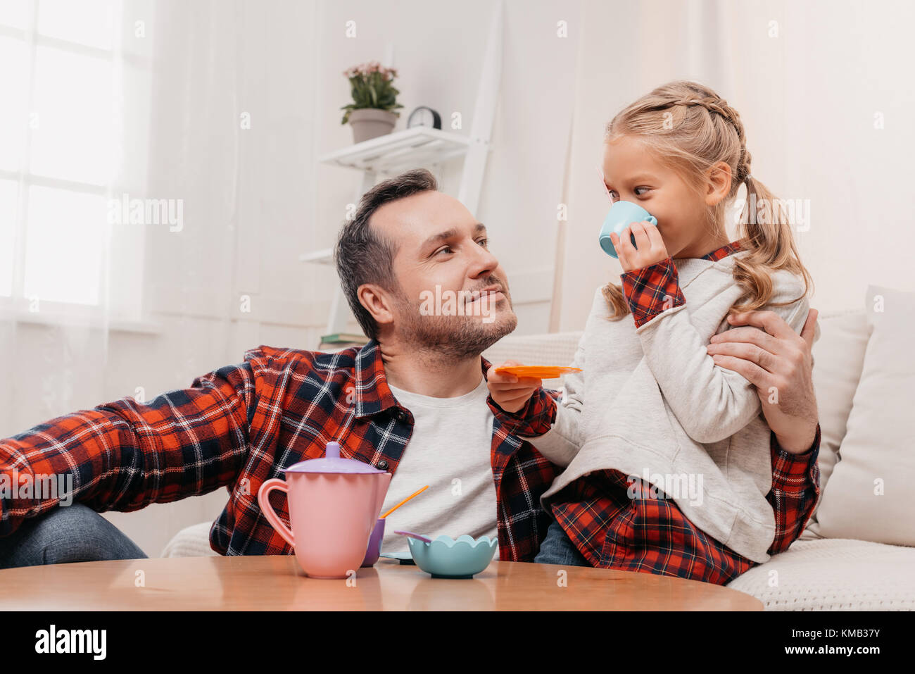 child having tea party with father Stock Photo - Alamy