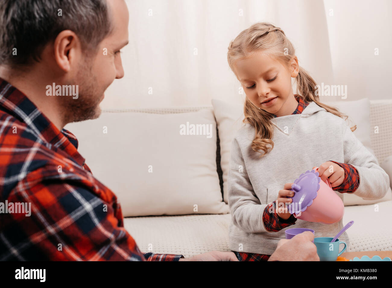 child having tea party with father Stock Photo - Alamy