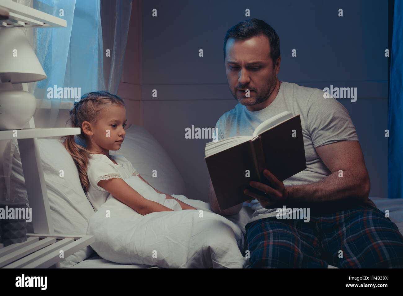 Book at bedtime hi-res stock photography and images - Alamy