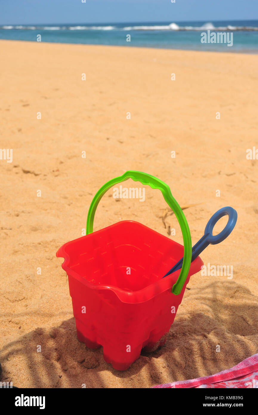 A bucket and spade on a sandy beach in Mozambique Stock Photo - Alamy