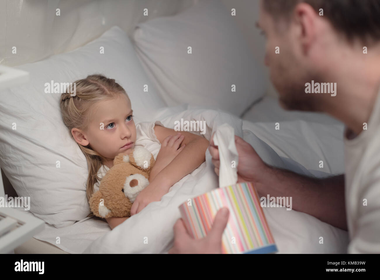 father and sick daughter in bed Stock Photo - Alamy