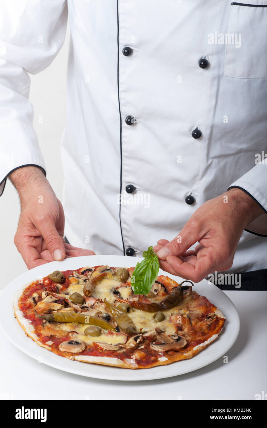 chef decorating a pizza with spices Stock Photo - Alamy