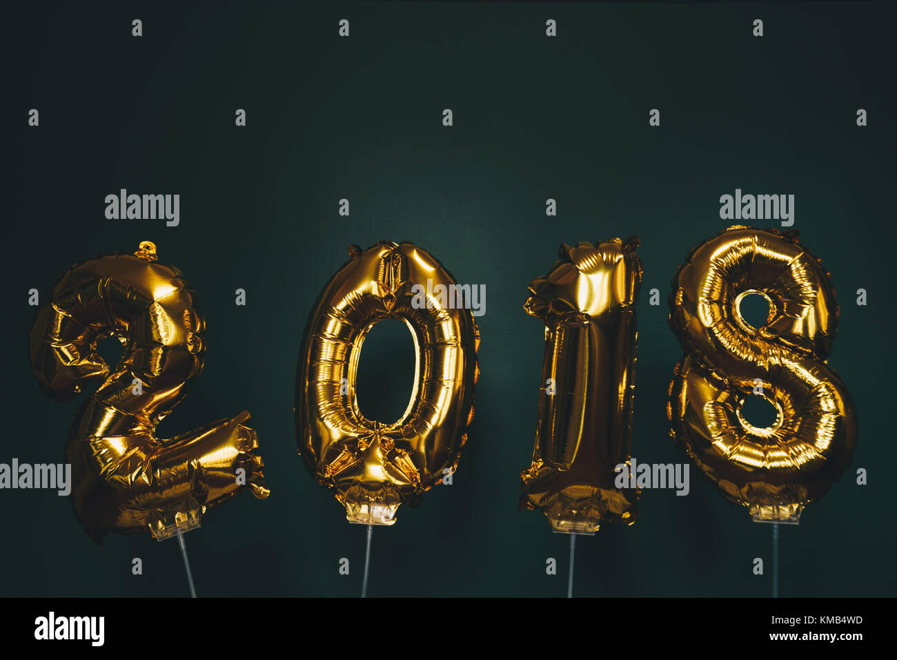 Hands holding golden 2018 balloons, new year concept Stock Photo - Alamy