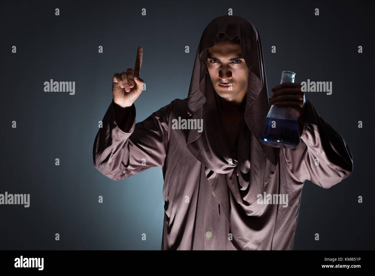 Alchemist doing experiments in alchemy concept Stock Photo - Alamy