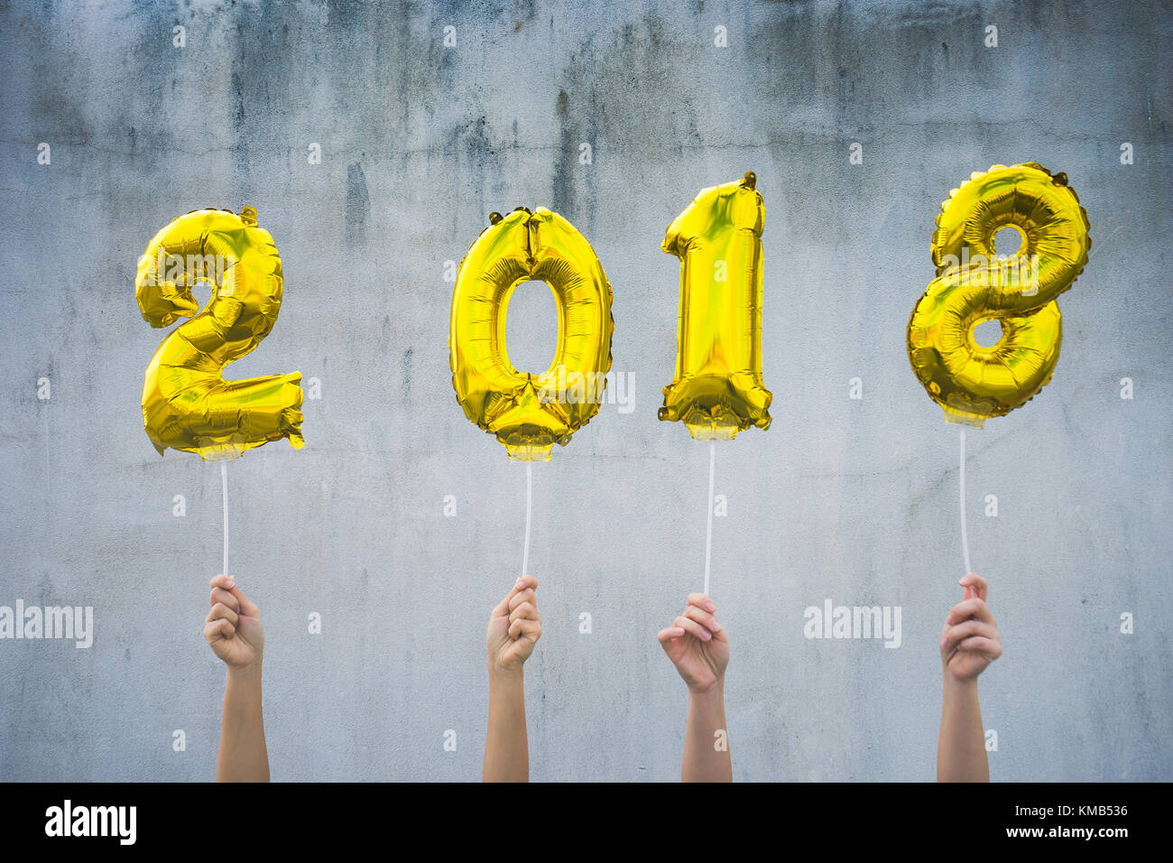 Hands holding golden 2018 balloons, new year concept Stock Photo - Alamy