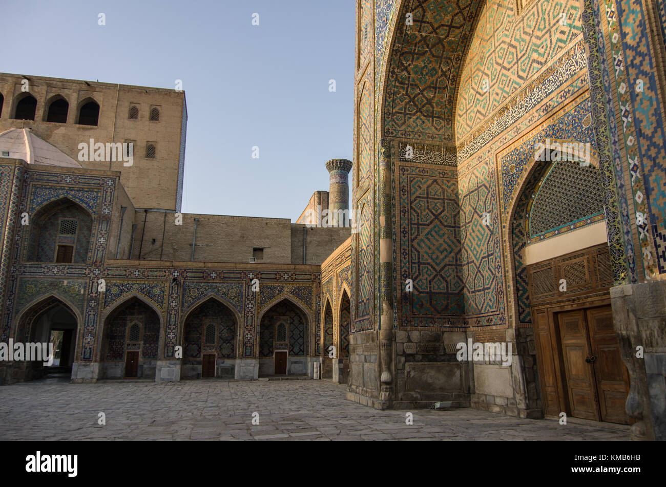 Morning sun in wall of madrasas with traditional mosaic ornament ...