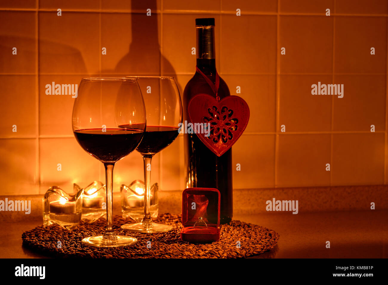 Romantic background with glasses of wine and ring Stock Photo - Alamy