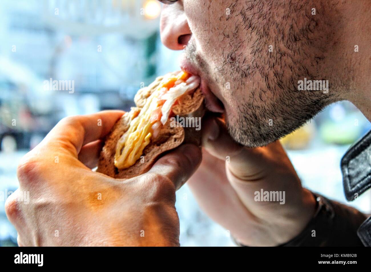 Pleasure of a bagel Stock Photo - Alamy