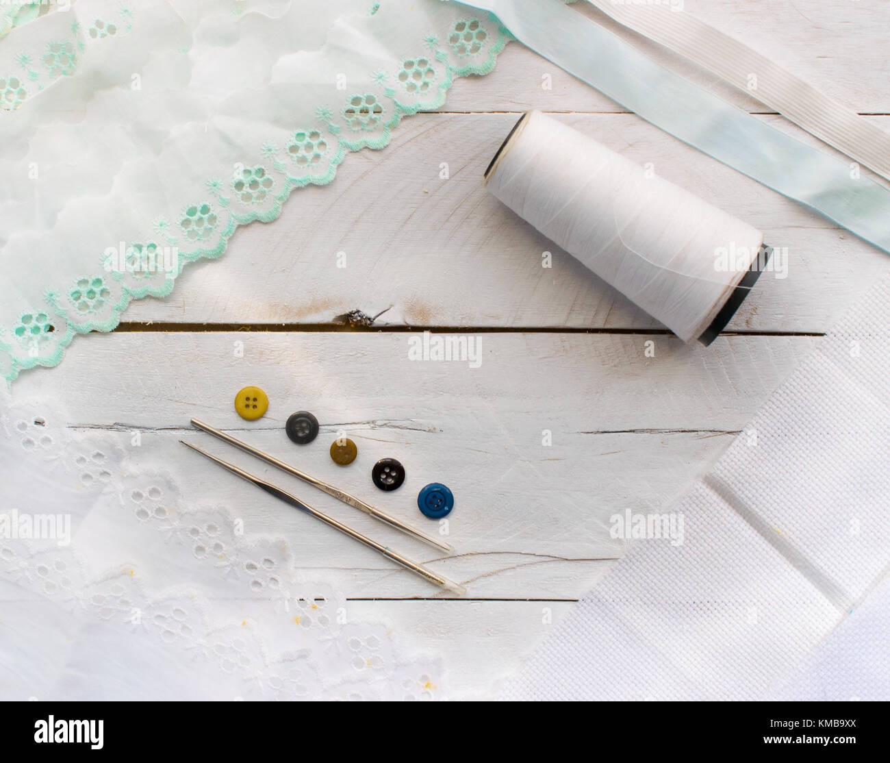 Thread spool, sewing thread line, metal needles and shirt buttons, with ...