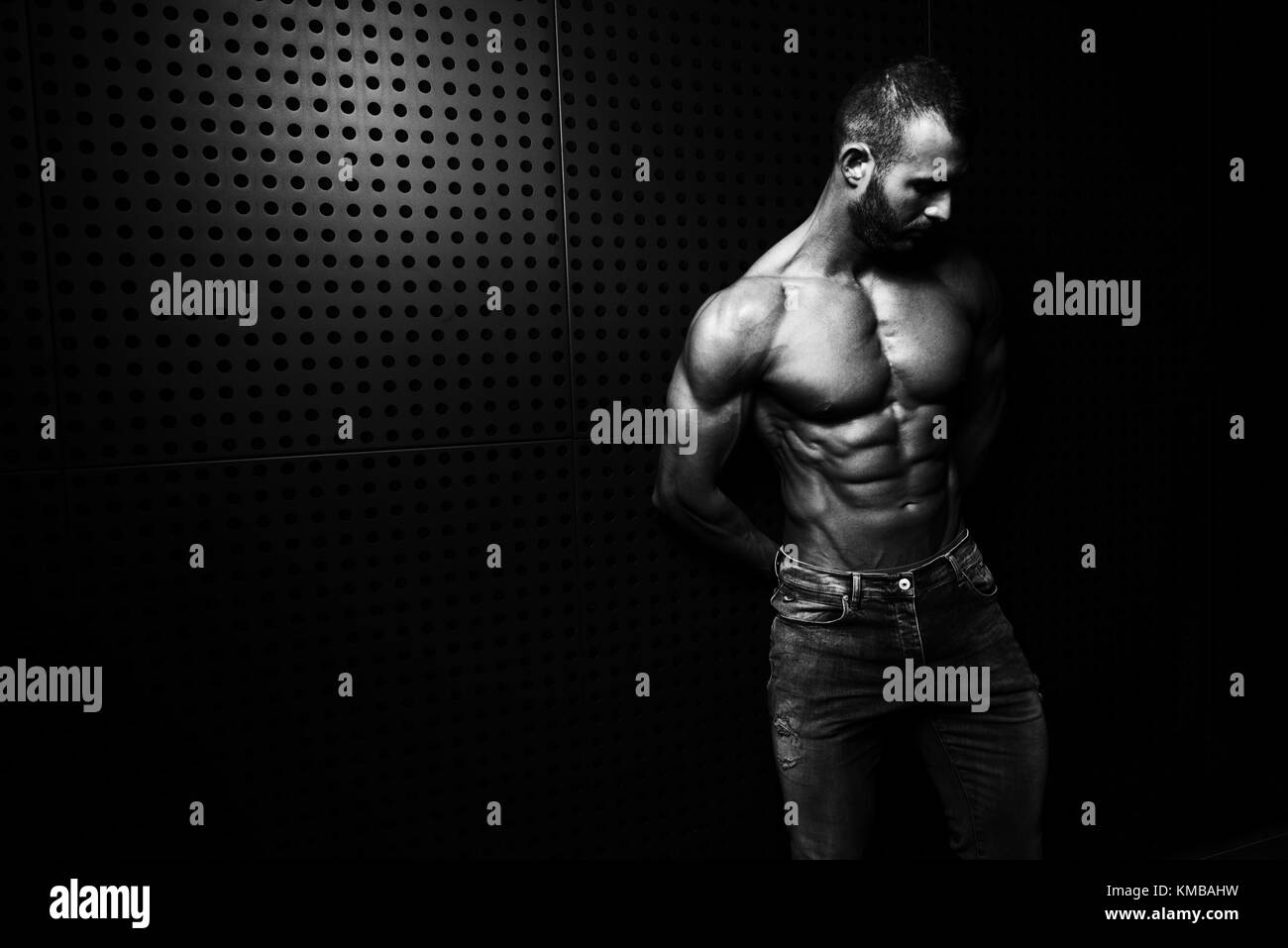 Young black man showing muscles hi-res stock photography and images - Alamy