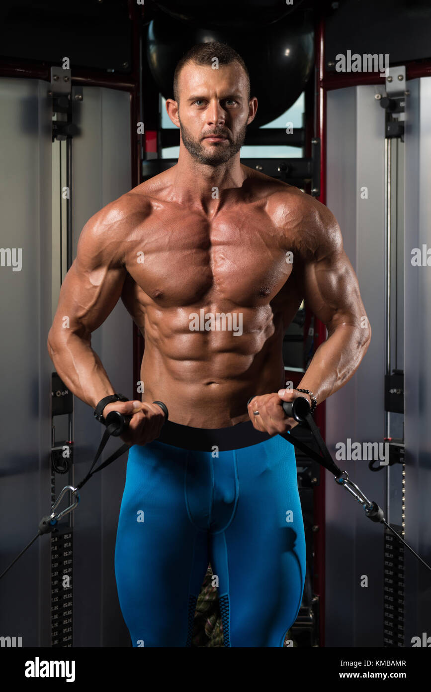 Handsome Muscular Fitness Bodybuilder Doing Heavy Weight Exercise For ...