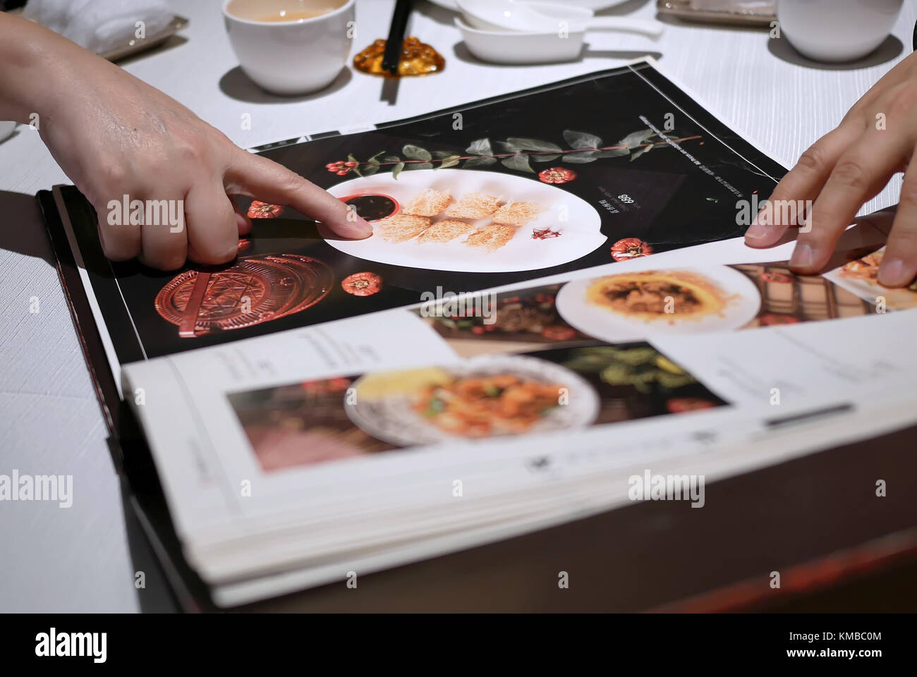 Taipei, Taiwan - October 21, 2017 : Motion of people looking at menu ...