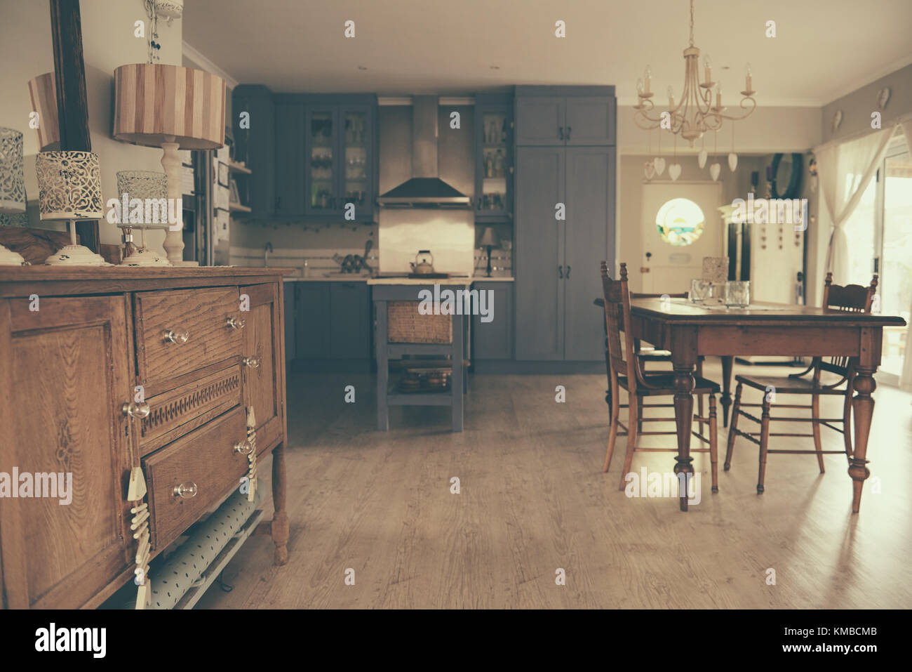 Dining area and country style kitchen of a home Stock Photo - Alamy