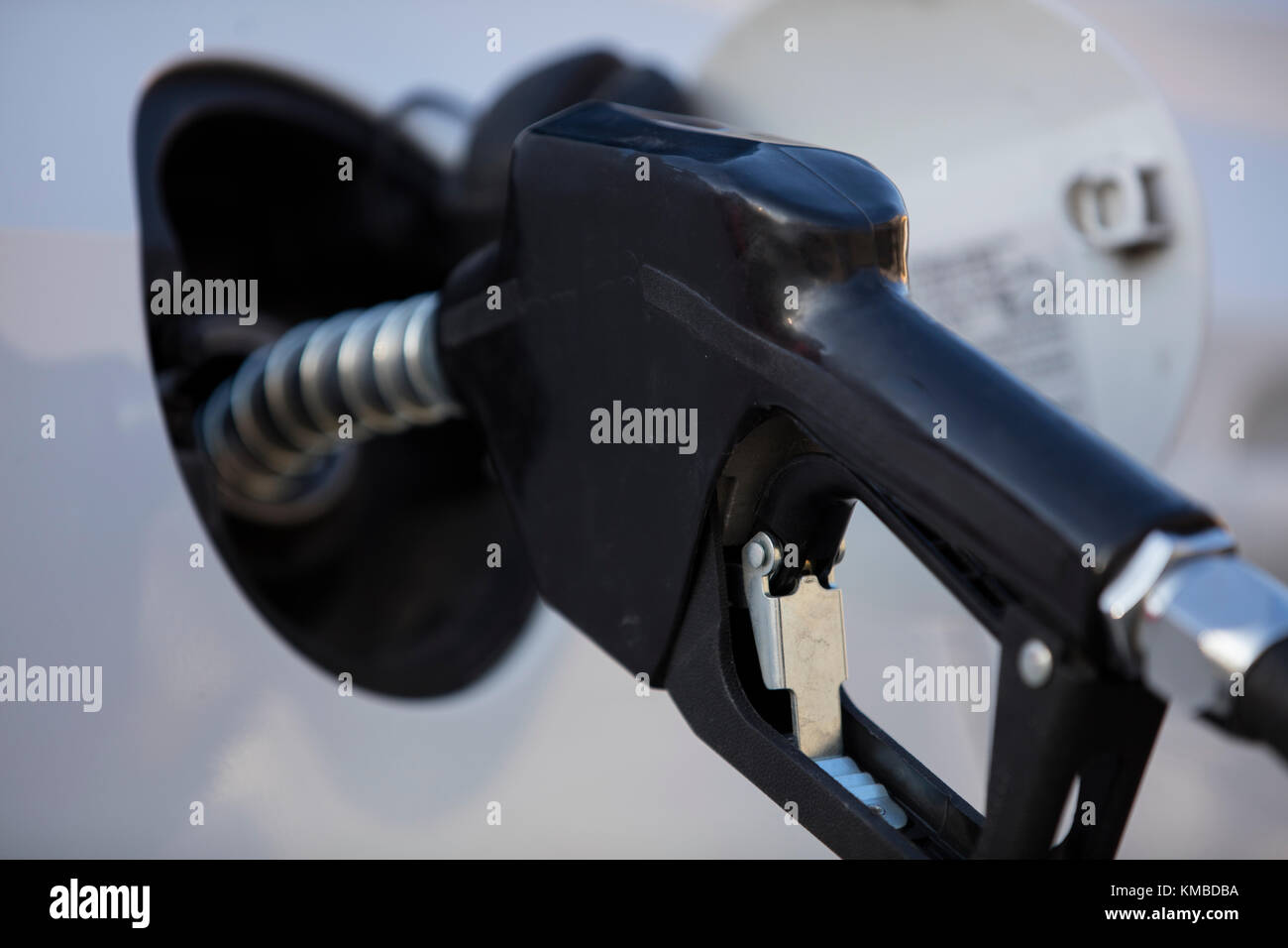 white car at gas station being filled with fuel Stock Photo - Alamy