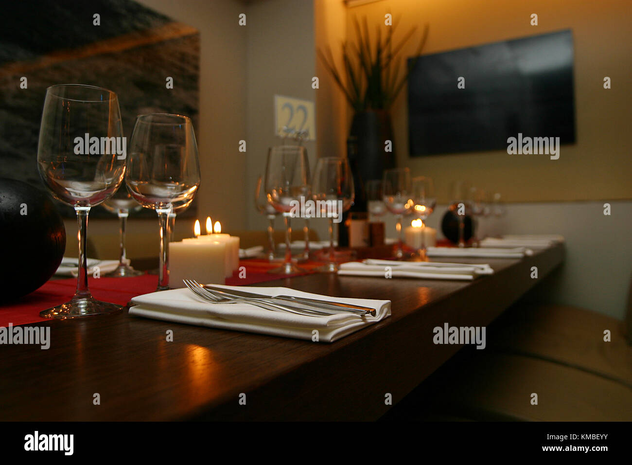 A bar in the restaurant is prepared for the arrival of diners, set up ...