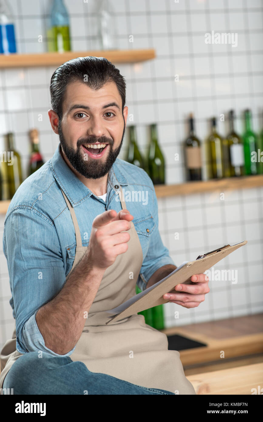 Emotional positive man smiling while getting a great idea Stock Photo ... Emotional positive man smiling while getting a great idea Stock Photo ...