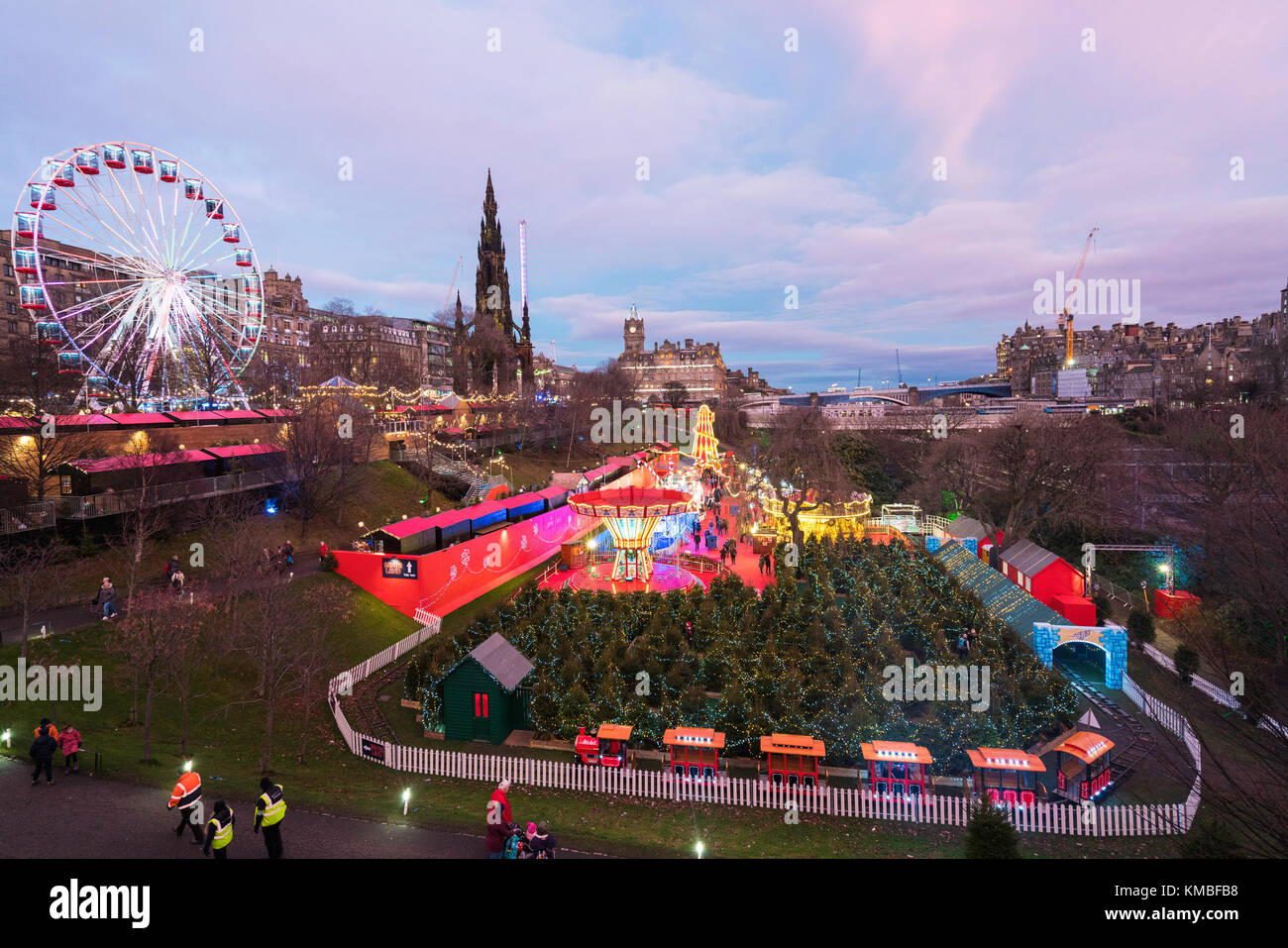 Evening view of funfair at annual Edinburgh Christmas Market in ...
