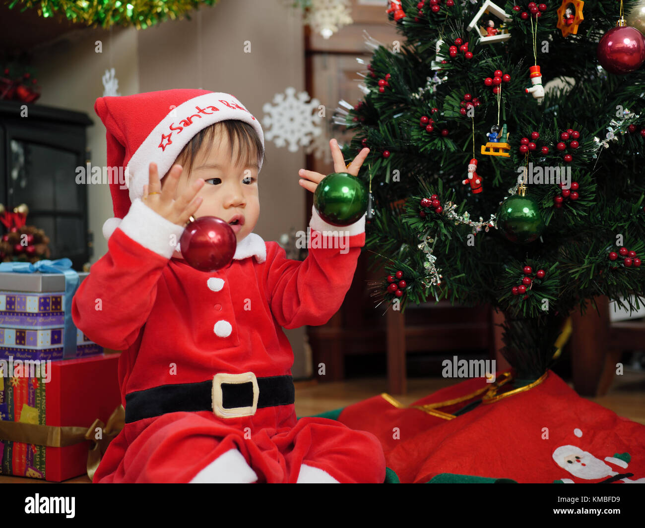 Happy santa baby girl Stock Photo - Alamy
