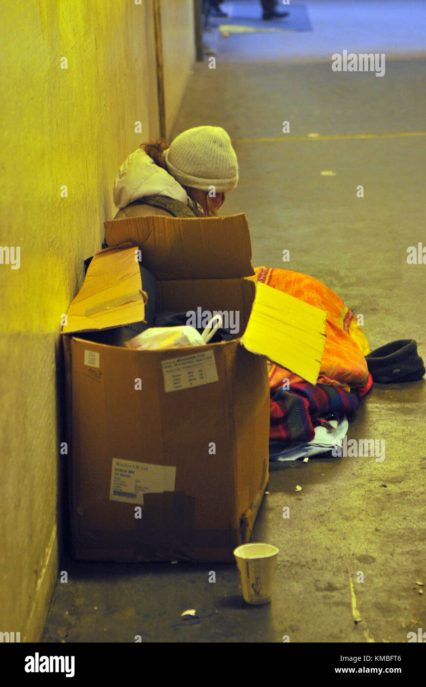 a young and homeless person sleeping rough on the streets of London ...