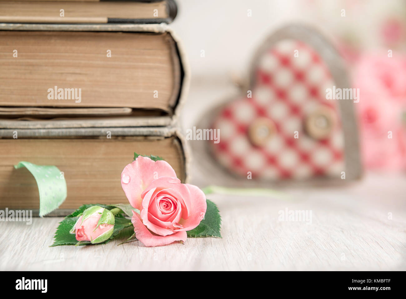 Love to reading, concept background with old books, checkered heart and ...