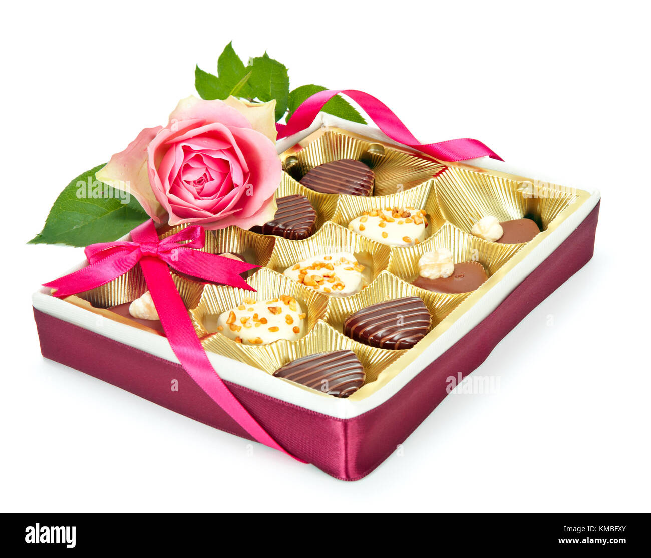 Box of chocolates and a rose on white background Stock Photo - Alamy