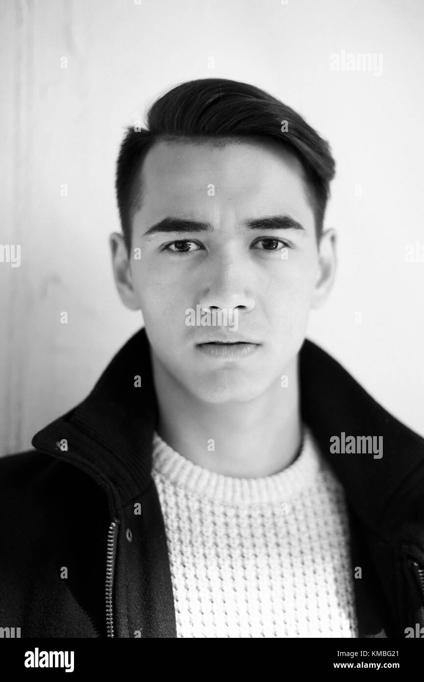 Young man looking into the camera ,open look. . Model posing Stock ...