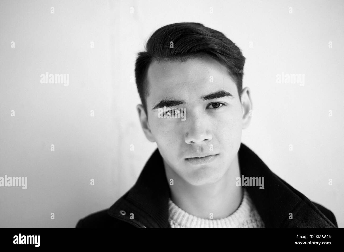 Young man looking into the camera ,open look. . Model posing Stock ...