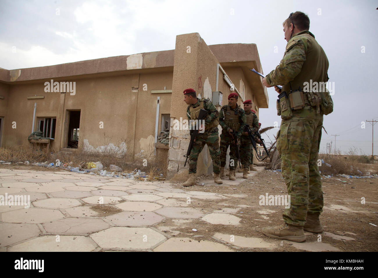An Australian trainer oversees members of the Iraqi Security Forces ...