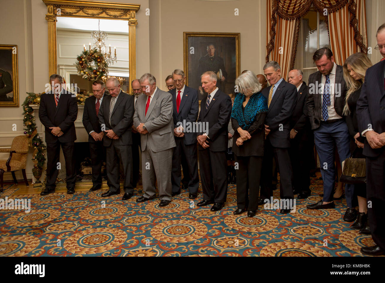 Guest bow their heads in prayer during a retirement ceremony for U.S ...