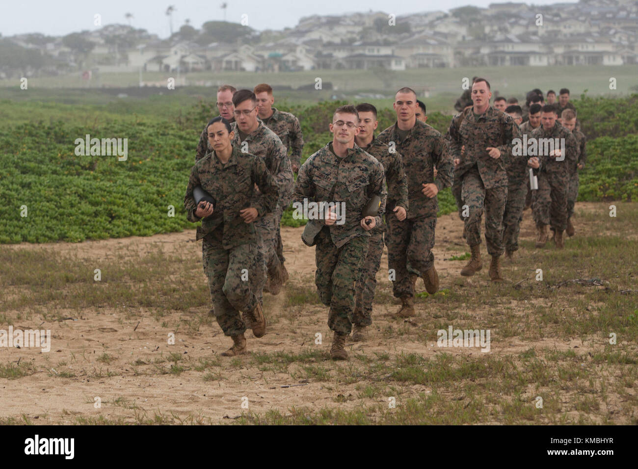 U.S. Marines with 3rd Radio Battalion return from a run during a ...
