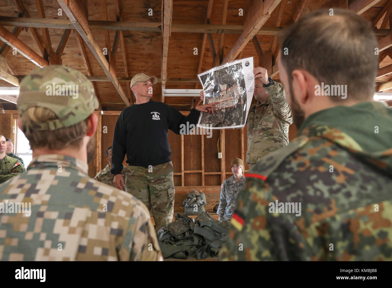 U.S. Army Jumpmaster Bryan Hahn, assigned to U.S. Civil Affairs ...